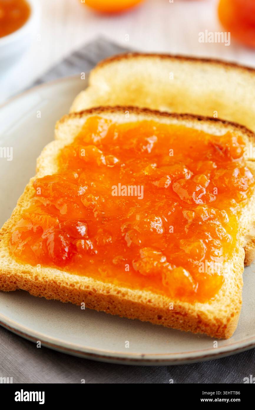 Sweet Homemade Apricot Jam on Toast for Breakfast Stock Photo - Alamy