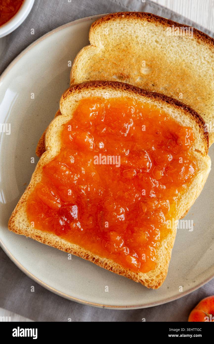 Sweet Homemade Apricot Jam on Toast for Breakfast Stock Photo - Alamy