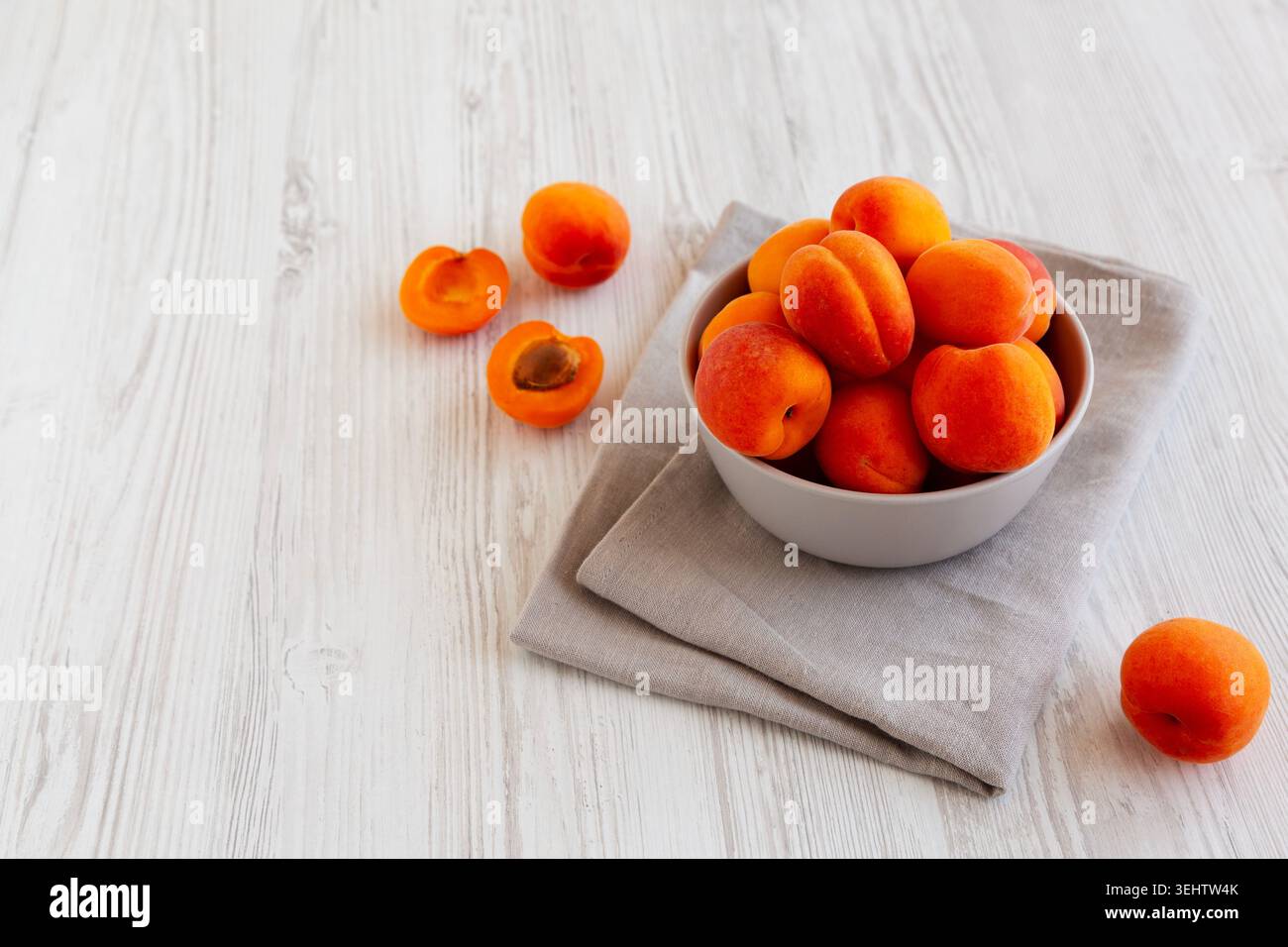 Raw Organic Apricots in a Bowl, side view. Copy space Stock Photo - Alamy