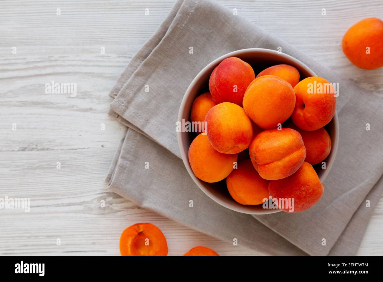 Raw Organic Apricots in a Bowl, top view. Copy space Stock Photo - Alamy