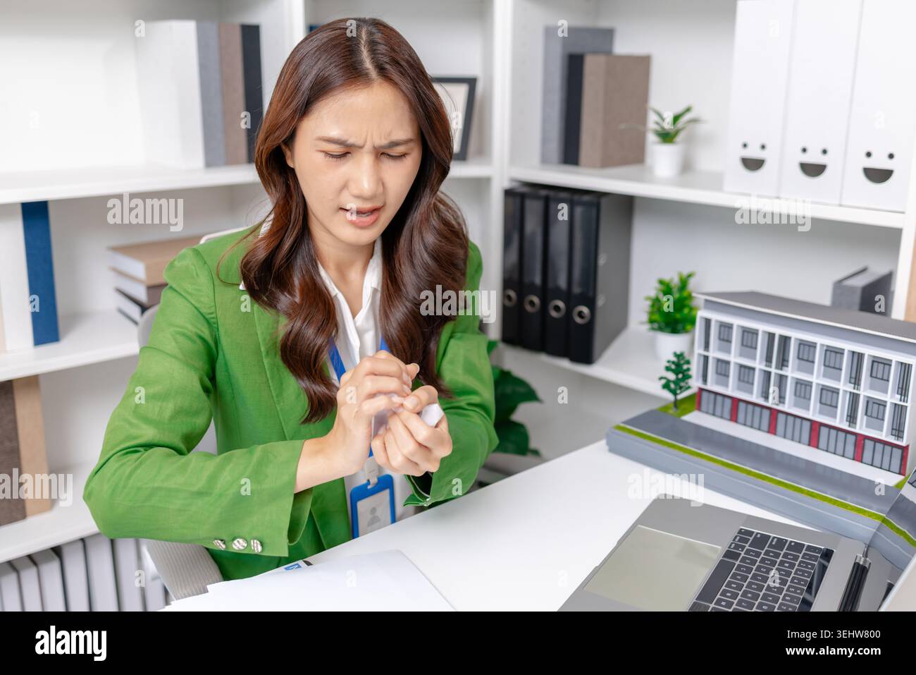 Stressed real estate consultant facing financial problems in office ...