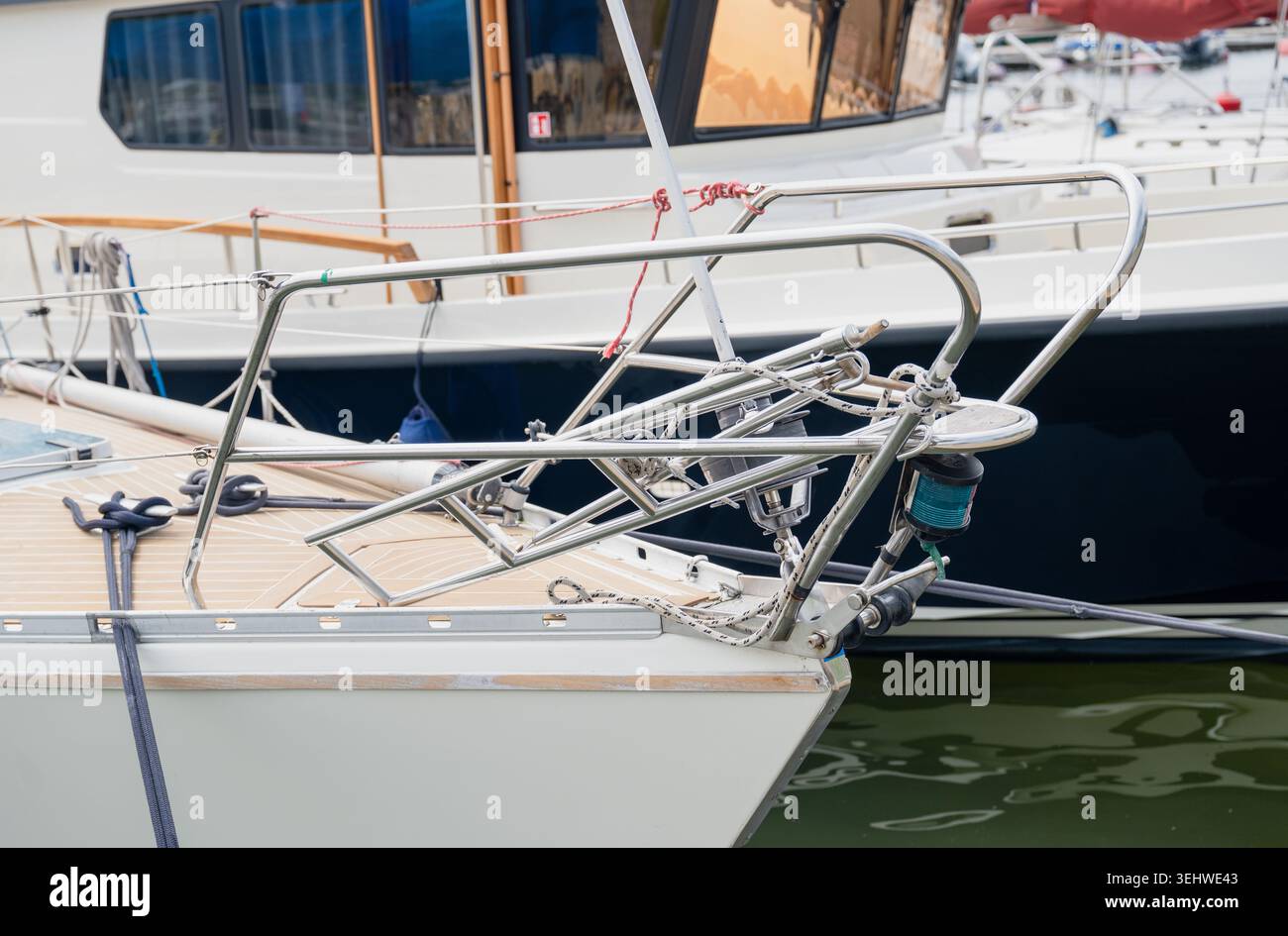 Sailboat bow with stainless steel railing and marine equipment in ...