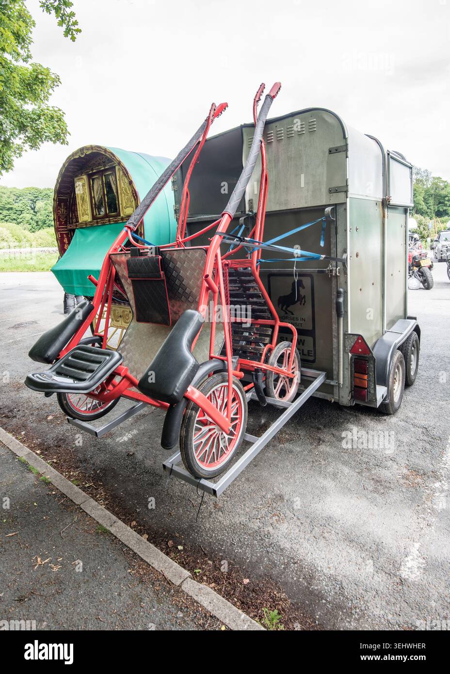 Traditional Romany bow-top Gypsy wagons or Vardos, pause on their ...