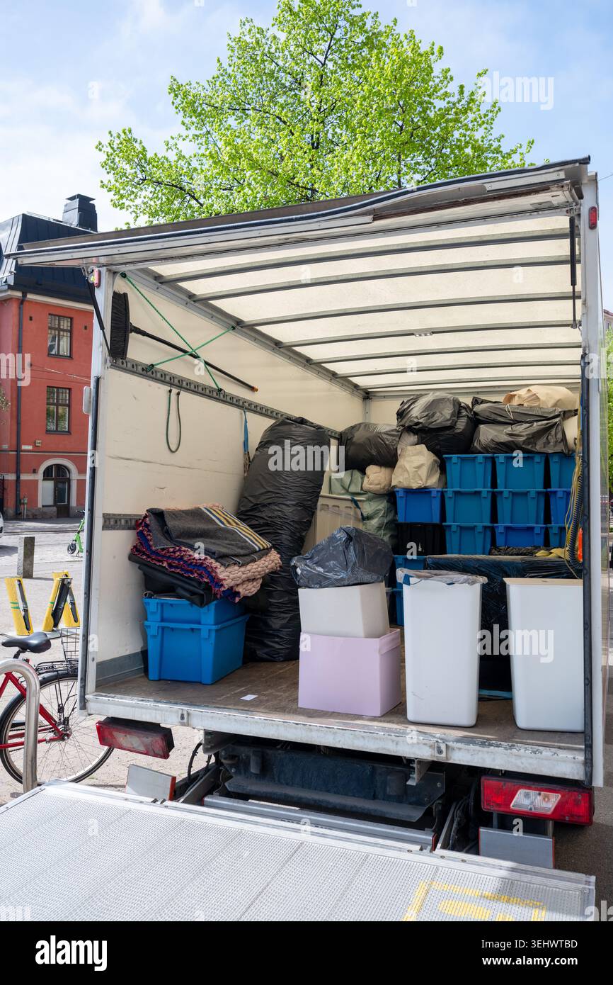 Loaded moving truck with packed household belongings and storage boxes ...