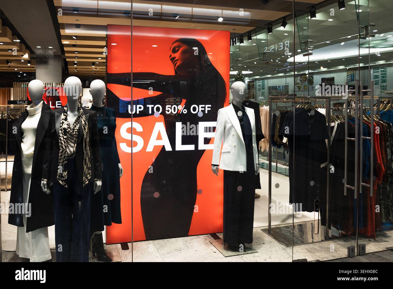 Storefront window display with sale sign and mannequins. London, UK, 24 ...