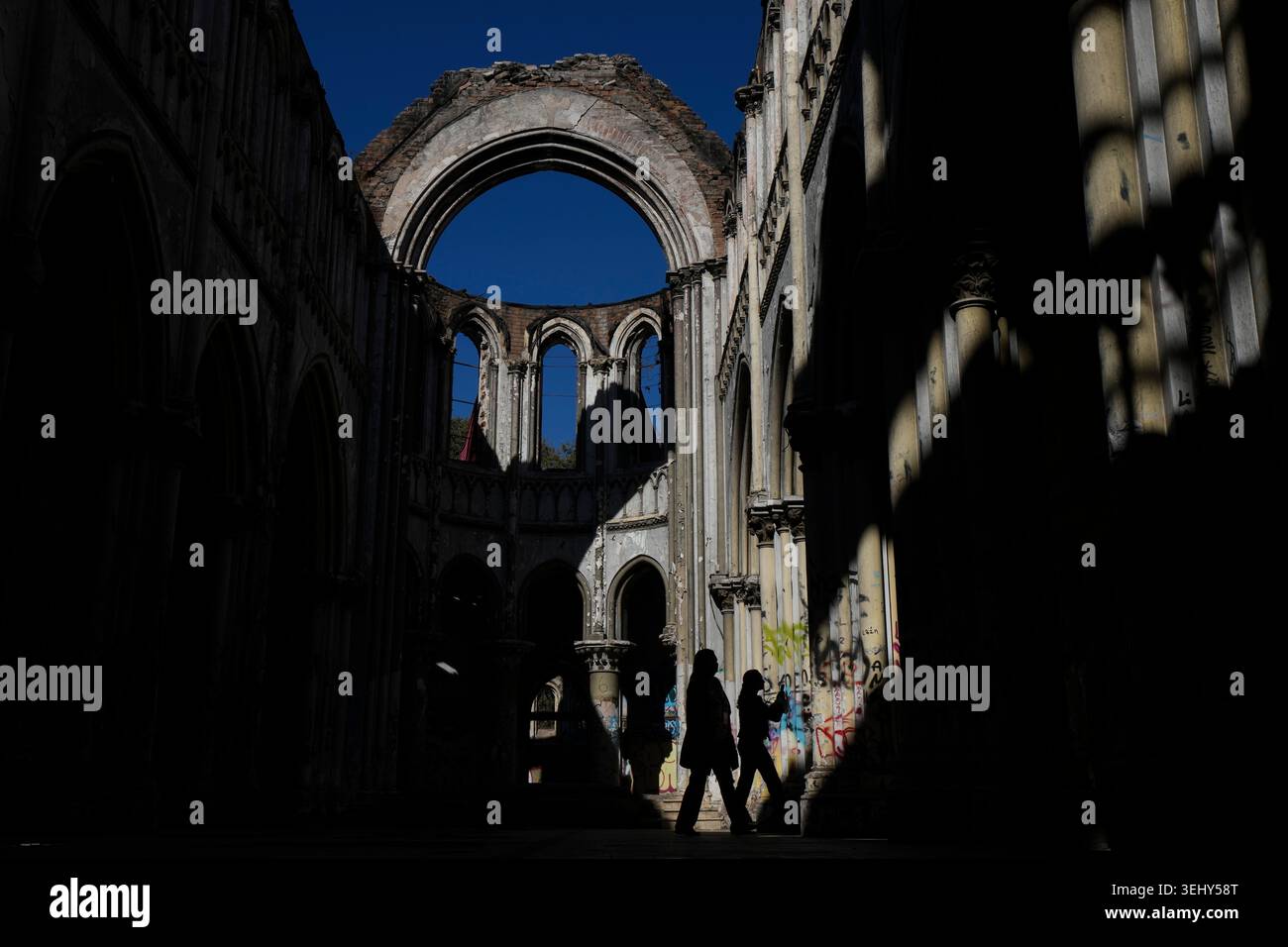 Women walk inside the neo-Gothic San Francisco de Borja church in ...