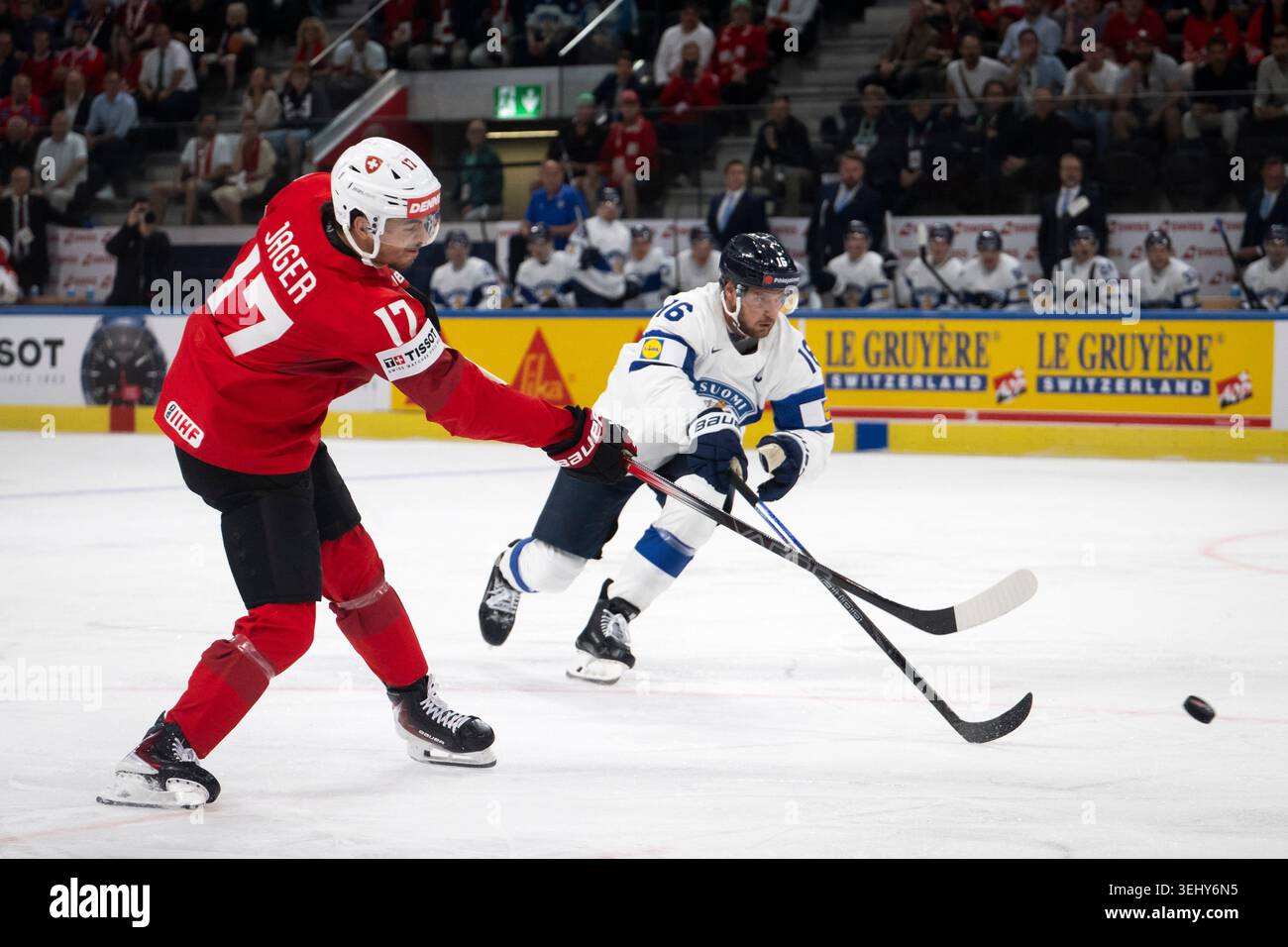Switzerland's Ken Jager scores during a preliminary round game between ...