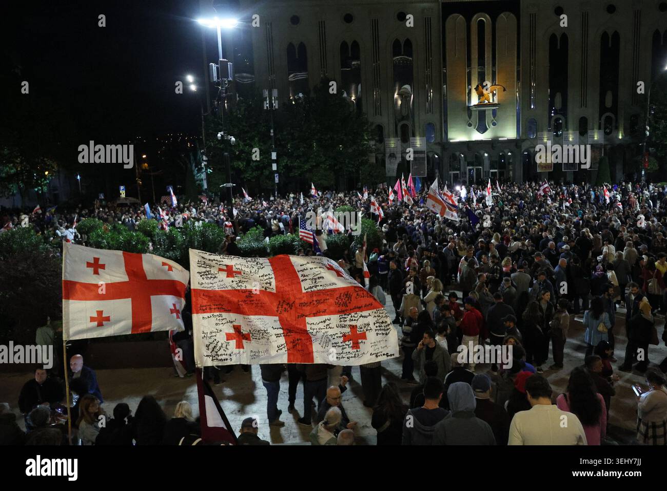 Demonstrators with Georgian national flags attend an opposition rally ...