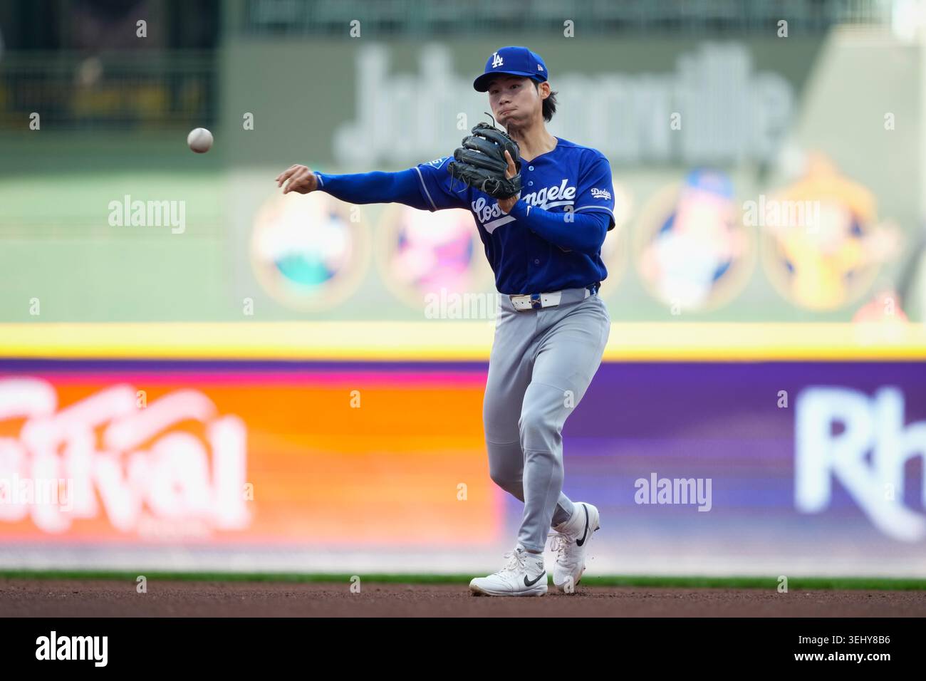 Los Angeles Dodgers' Hyeseong Kim throws to first base during the ...