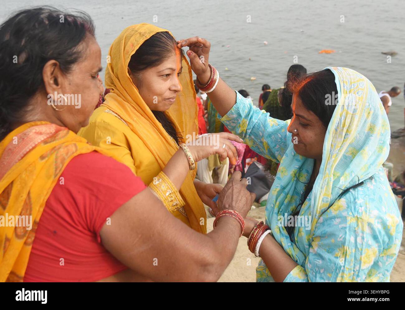 PATNA, INDIA - MAY 26: Devotee ladies perform rituals at the bank of ...