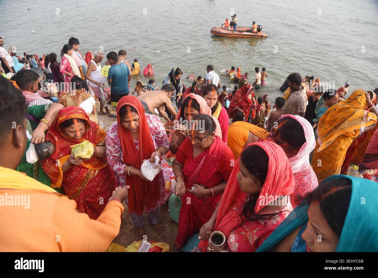 PATNA, INDIA - MAY 26: Devotee ladies perform rituals at the bank of ...