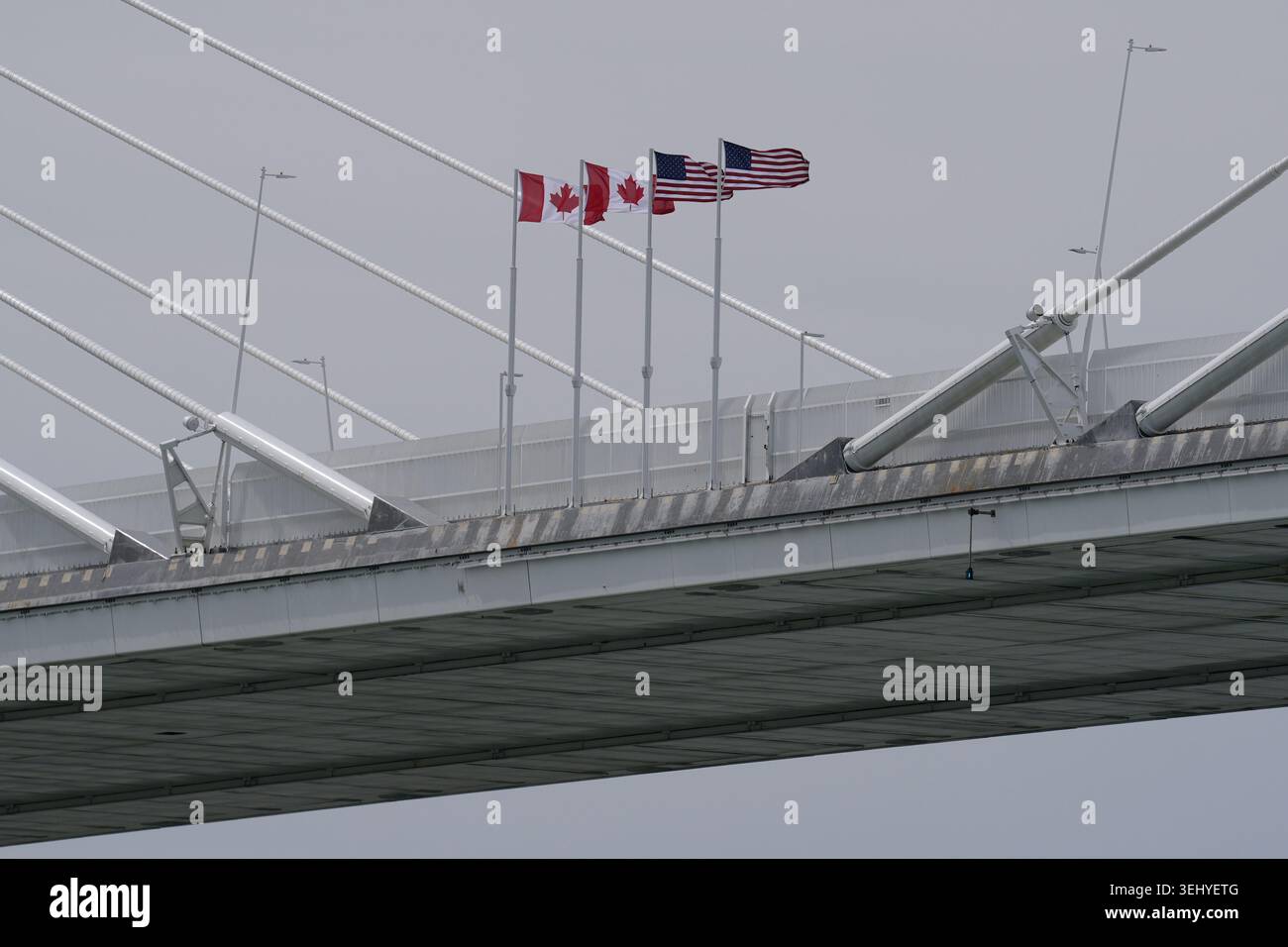 Canadian and American flags are shown on the Gordie Howe Bridge under ...