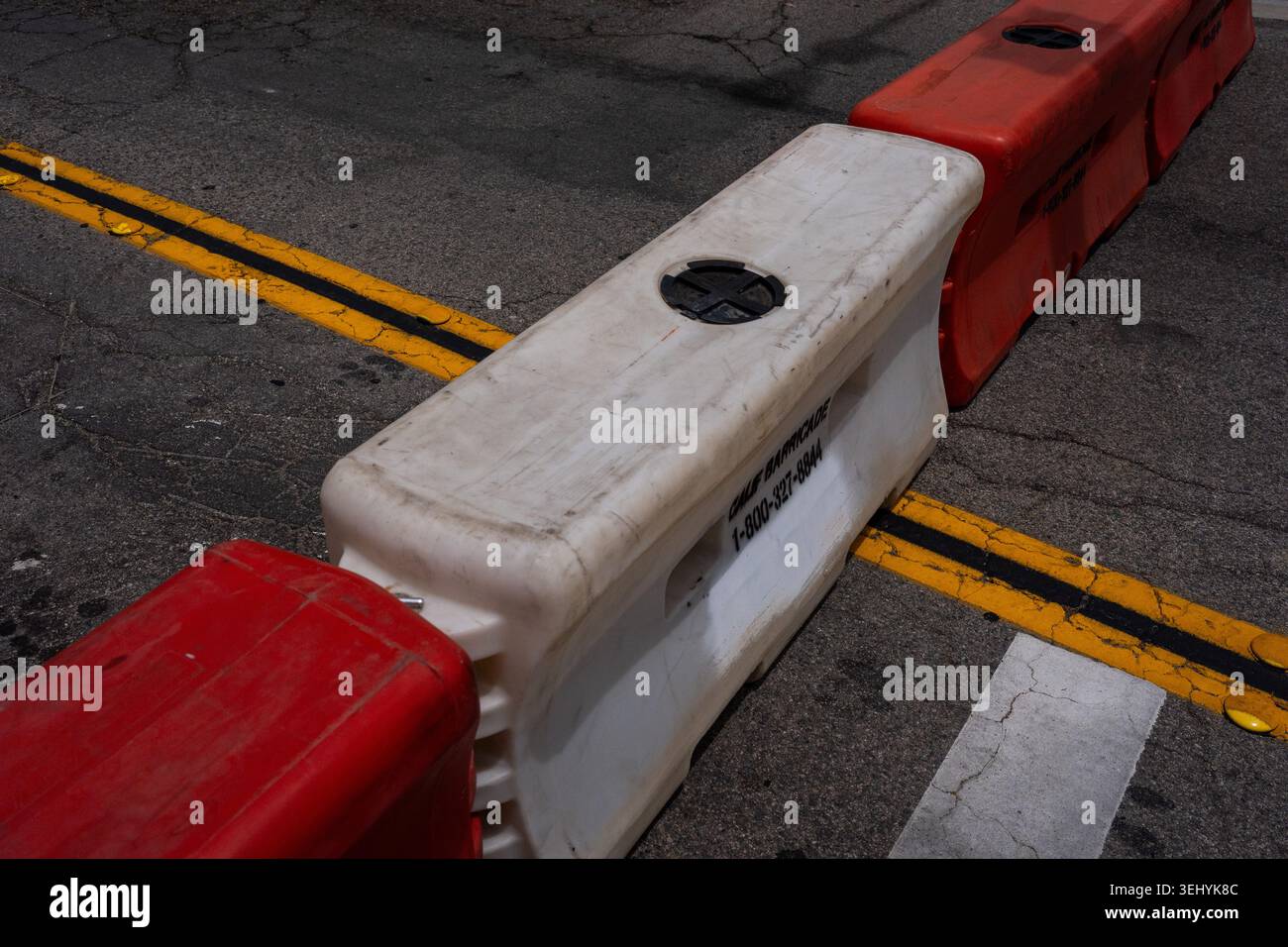 Barricades block a street in the evacuation zone in Garden Grove, Calif ...