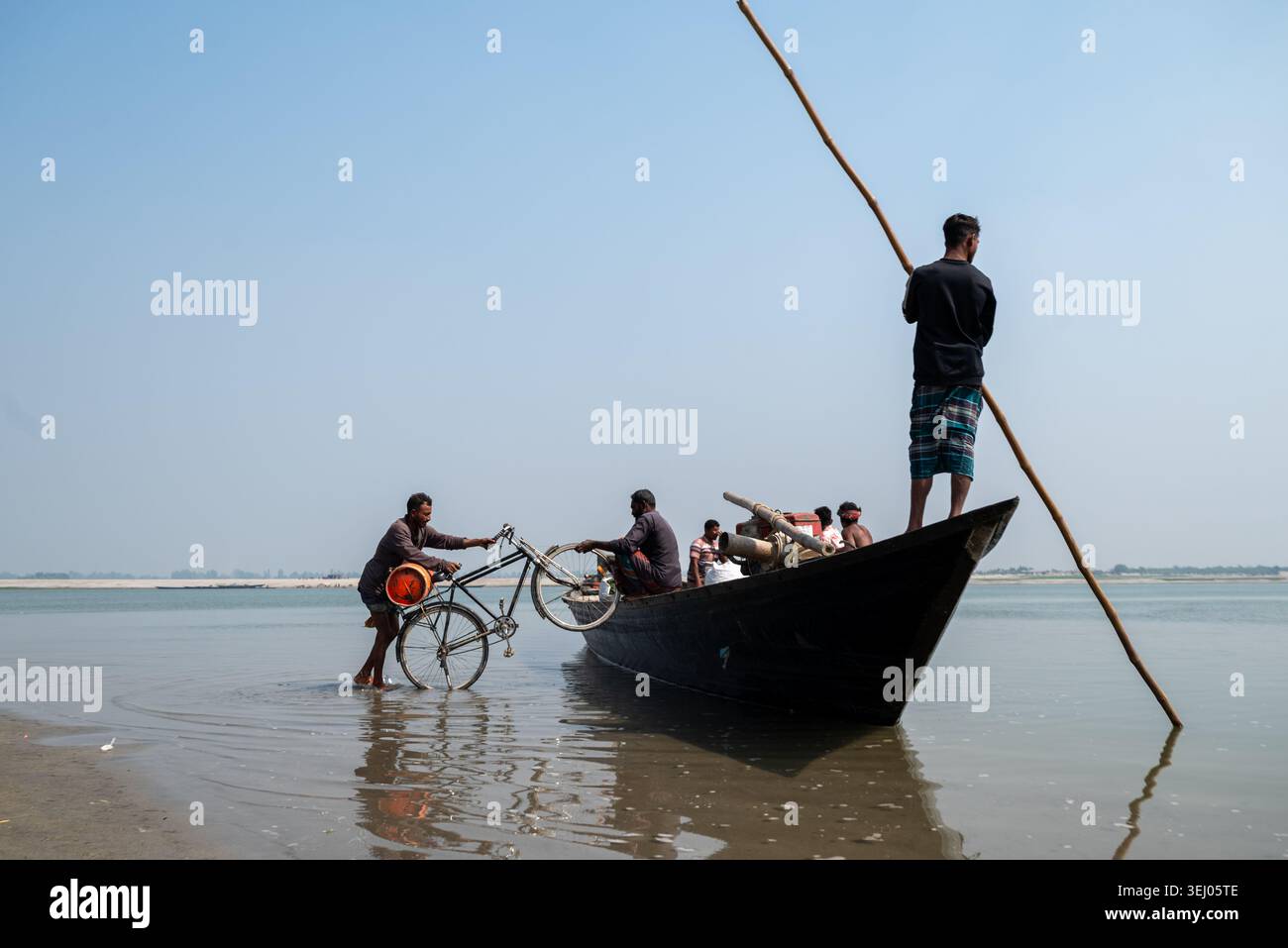 Gaibandha, Bangladesh - 15 February 2026: View of men on a wooden boat ...