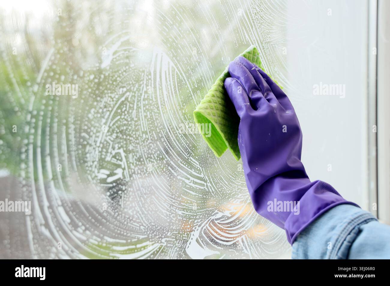Female hand with rag washing window in room, closeup Stock Photo - Alamy
