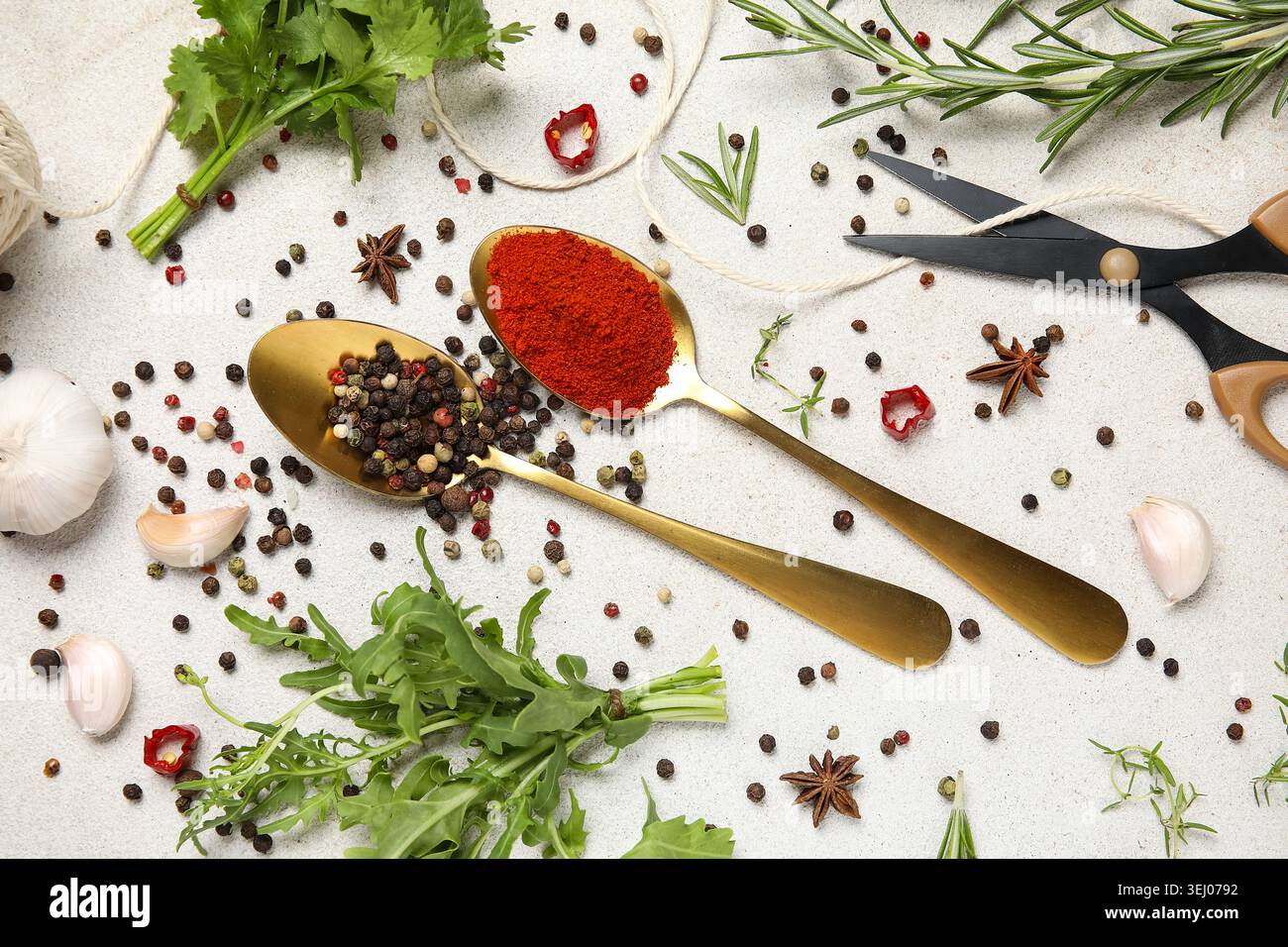 Composition with herbs, threads, scissors and spoons of spices on white ...