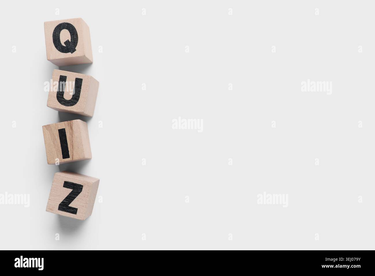 Word QUIZ made of wooden cubes on white background Stock Photo - Alamy