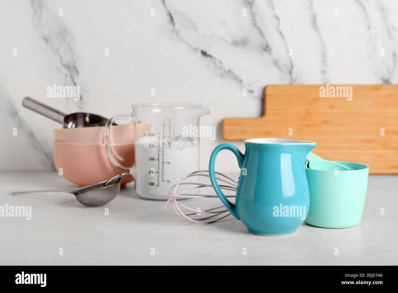 Set of different baking utensils and flour on light background Stock ...
