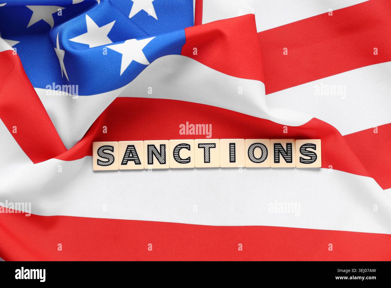 Word SANCTIONS on USA flag Stock Photo - Alamy