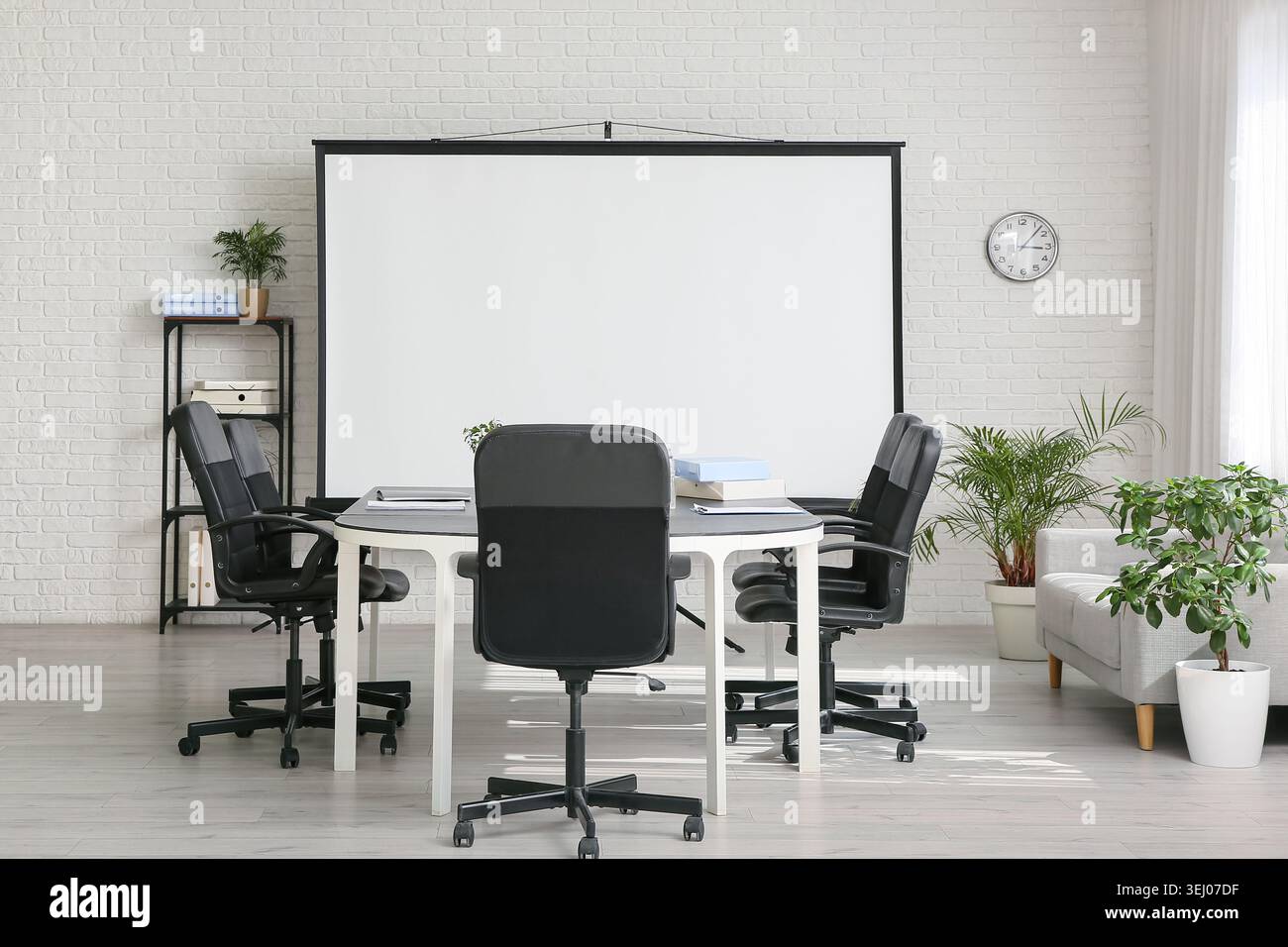 Interior of conference hall with table, shelving unit and projector ...