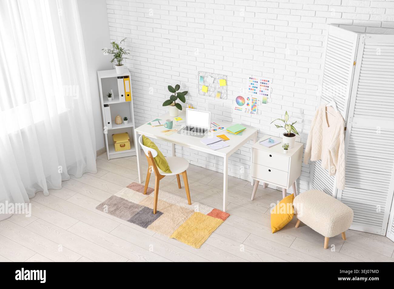 Interior of designer's office with workplace, shelf unit and folding ...