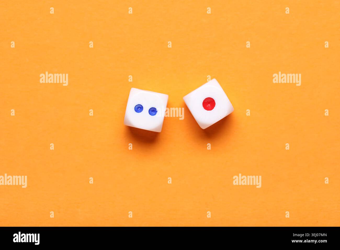 White game dices on orange background Stock Photo - Alamy