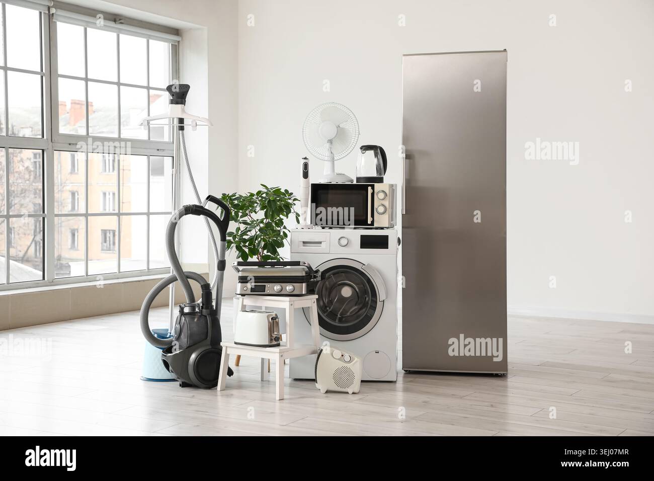 Interior of living room with different modern household appliances near ...