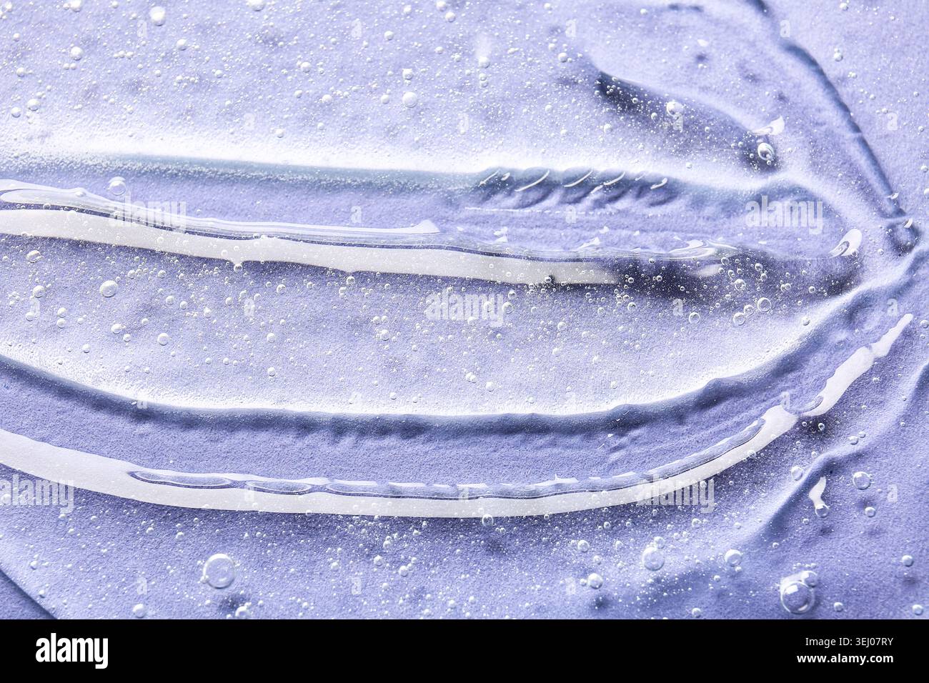 Texture of shower gel on lilac background, closeup Stock Photo - Alamy
