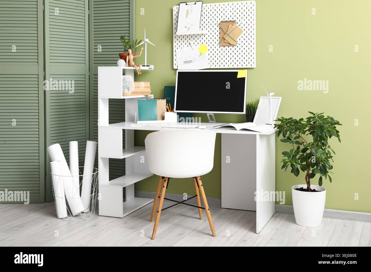 Interior of office with engineer's workplace, pegboard and folding ...