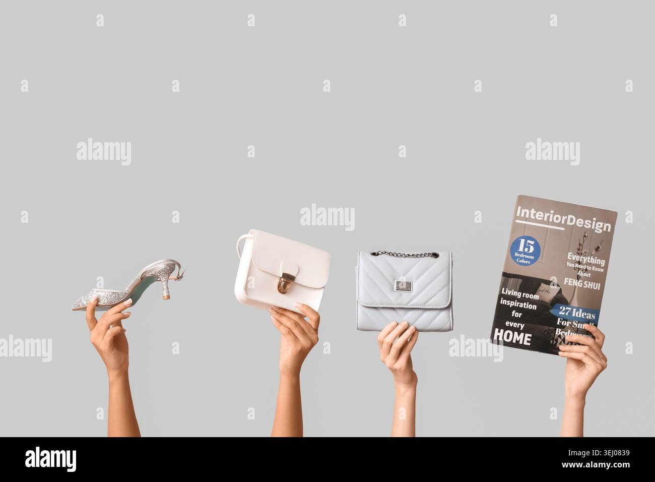 Female hands with magazine, high heel and stylish bags on grey ...