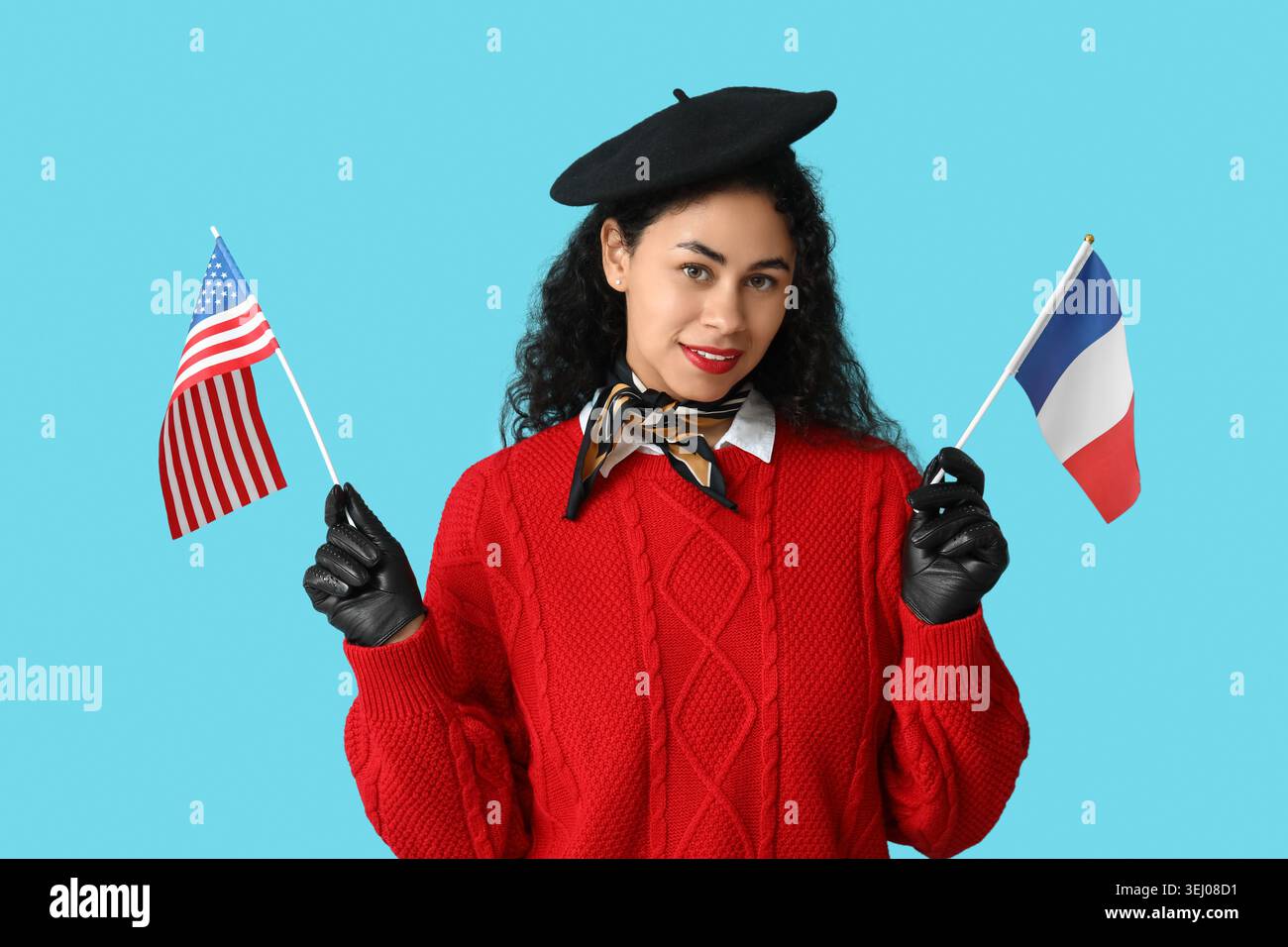 Beautiful young happy African-American woman with USA and France flags ...