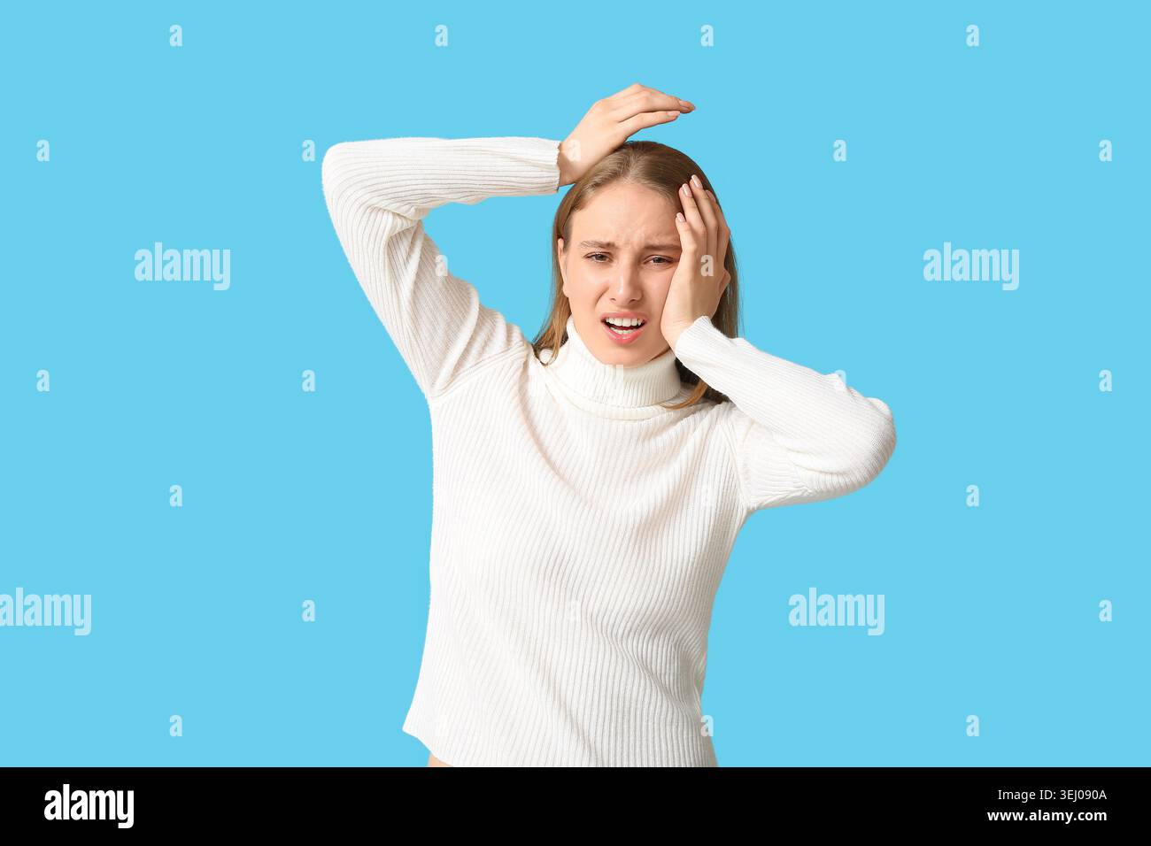 Beautiful young woman suffering from toothache on blue background Stock ...