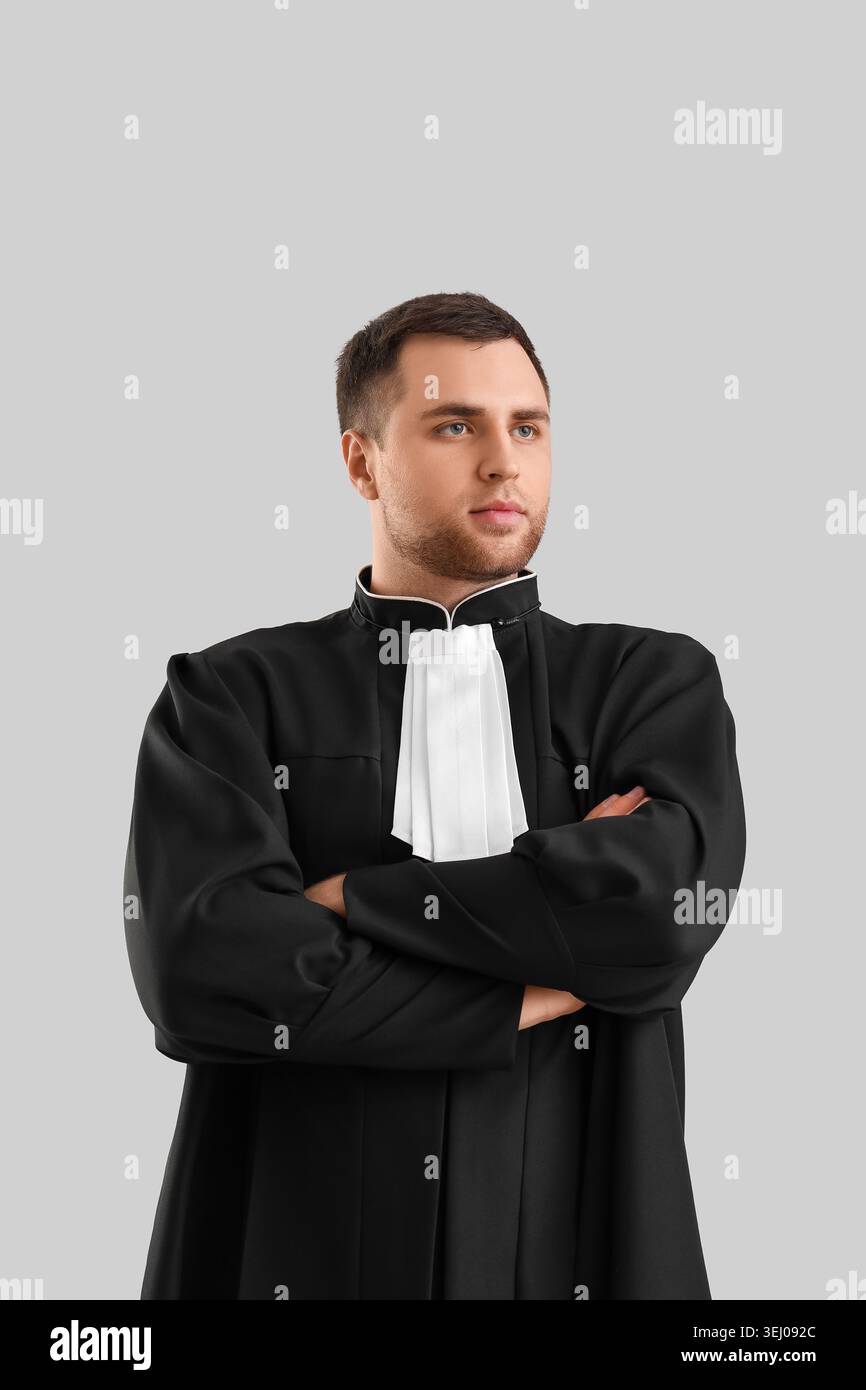 Male judge on light background Stock Photo - Alamy