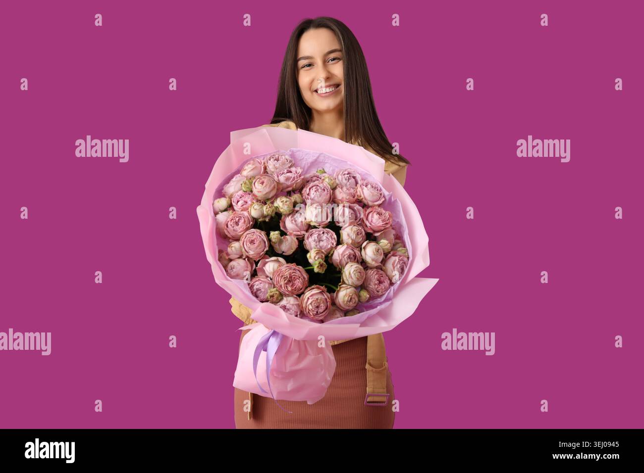 Young woman with bouquet of beautiful roses on purple background Stock ...
