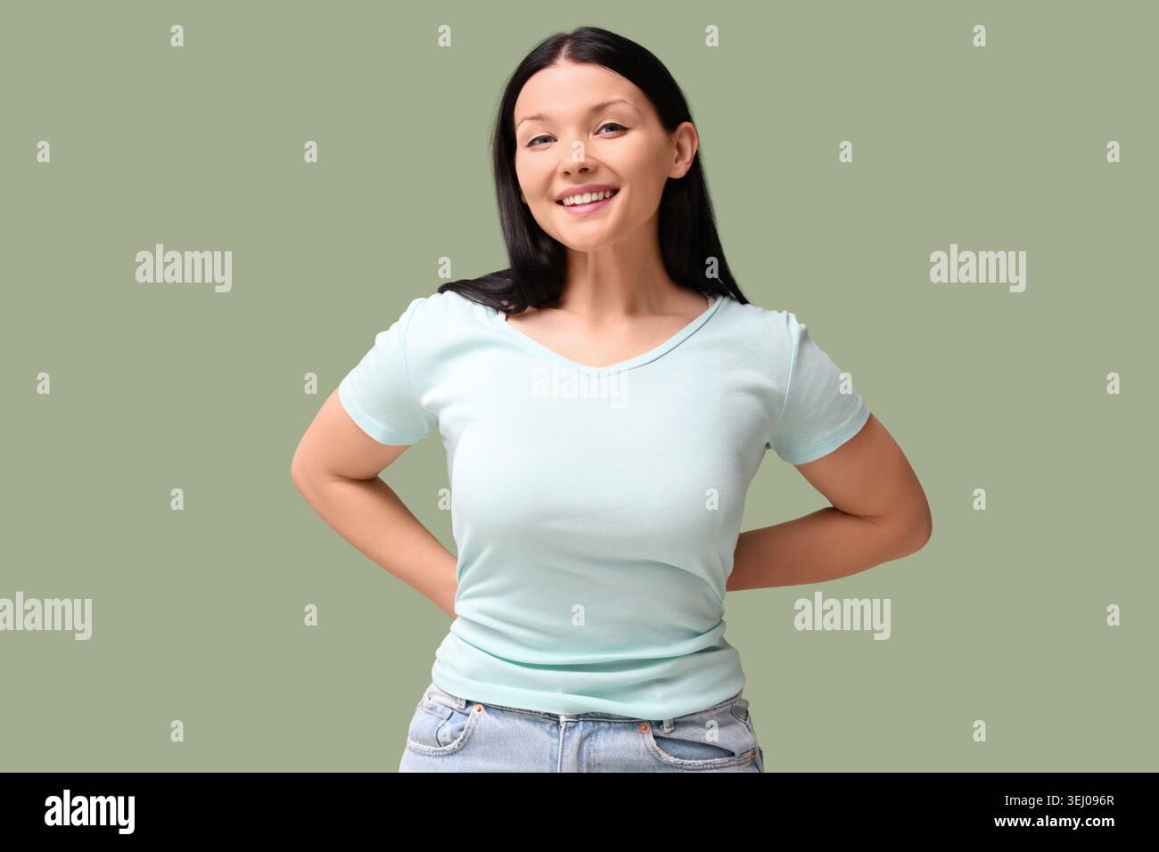 Beautiful young happy slim woman on green background. Weight loss ...