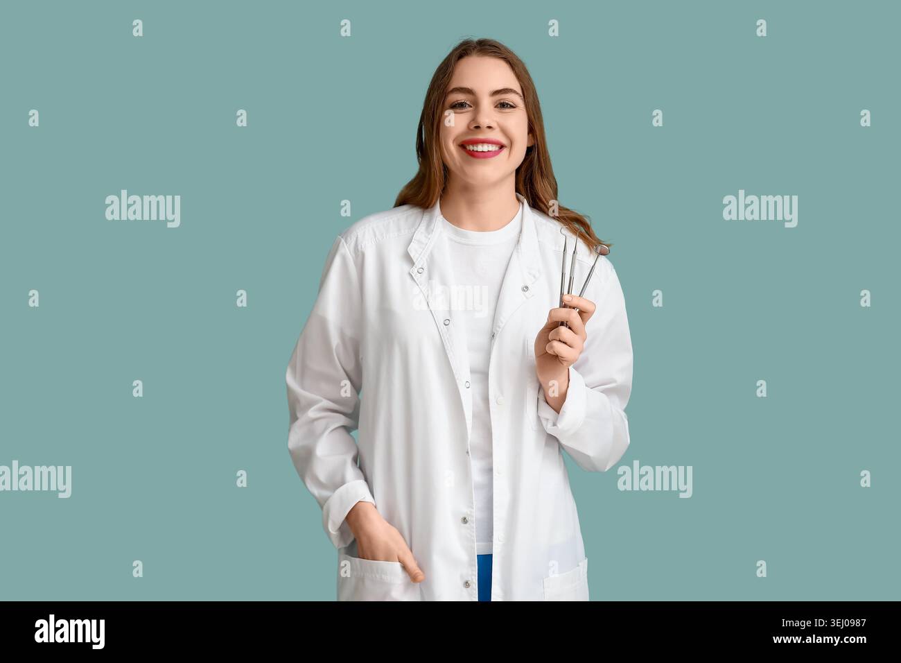 Female dentist with dental tools on blue background. World Dentist Day ...