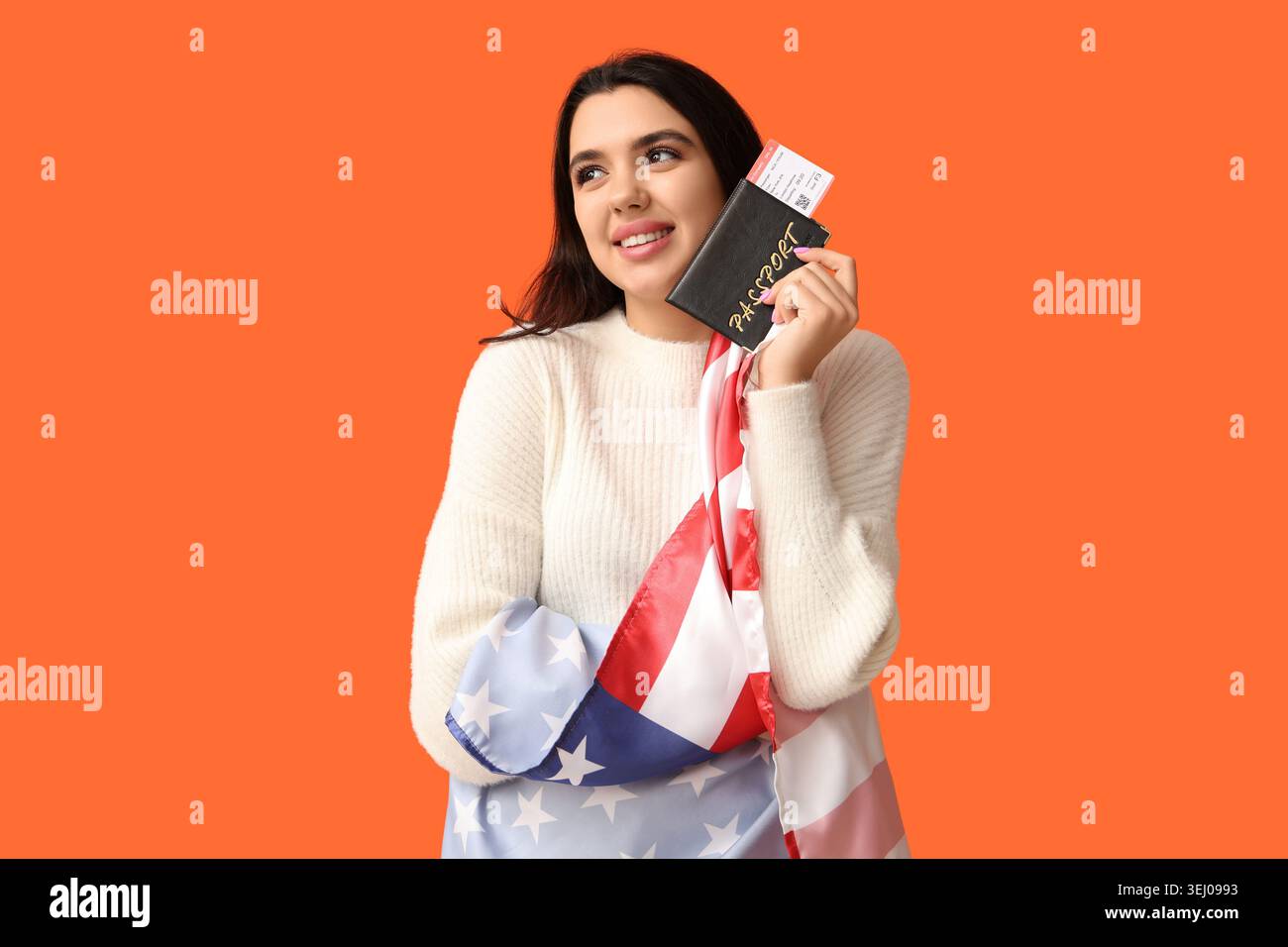Beautiful young happy woman with USA flag, passport and ticket on ...