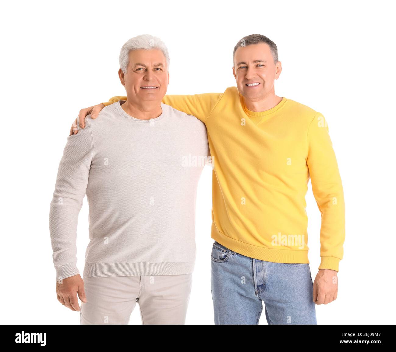 Mature brothers hugging on white background Stock Photo - Alamy