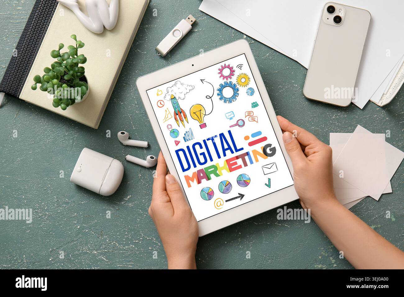 Female hands with tablet computer on grey grunge background. Concept of ...