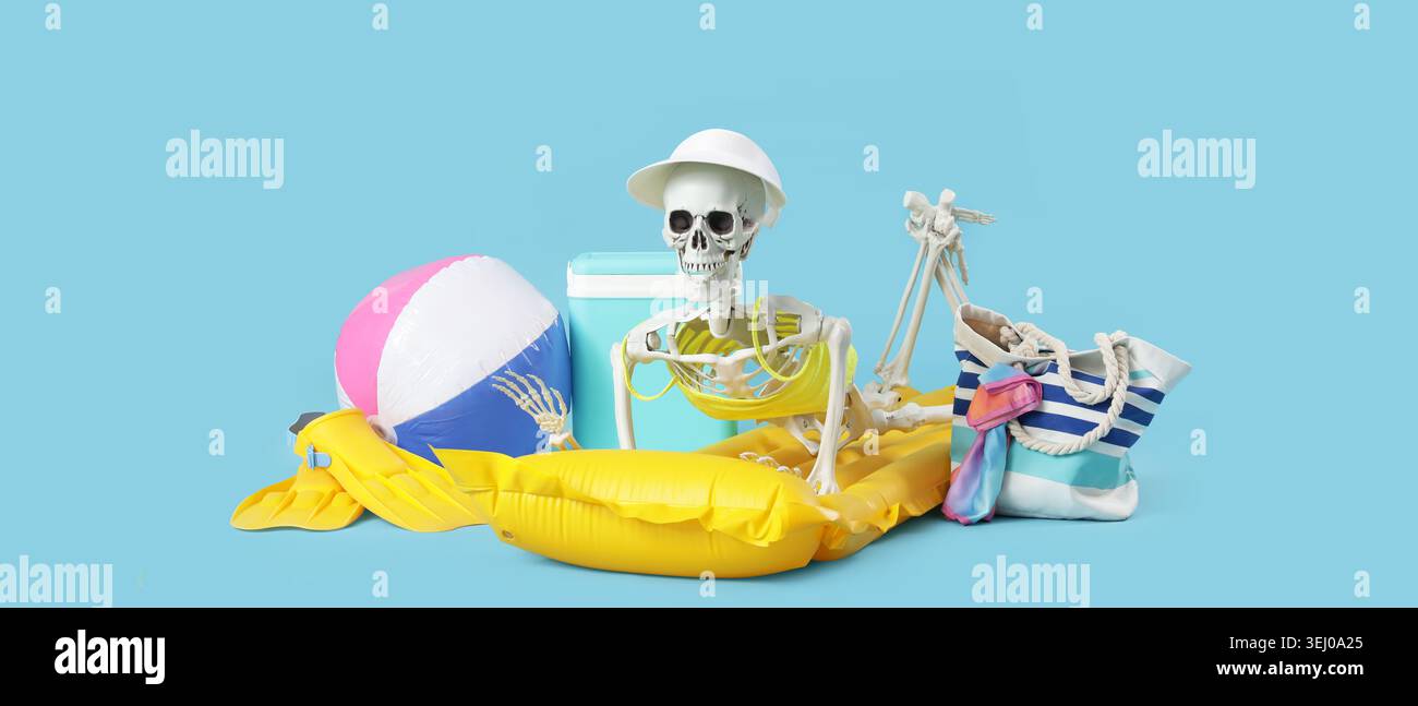 Human skeleton with beach accessories on blue background. Summer ...