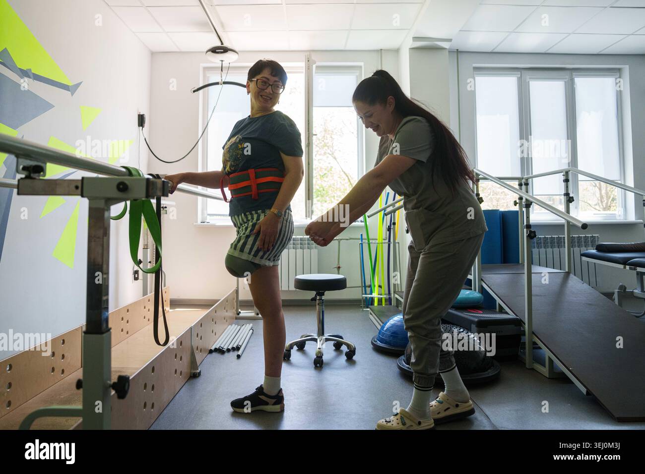 Physical therapist Anastasiia Stetsenko stretches Iryna Nakonechna ...