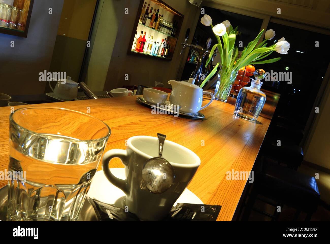 a barkeeper or bartender mixing drinks together in a bar barkeeper ...