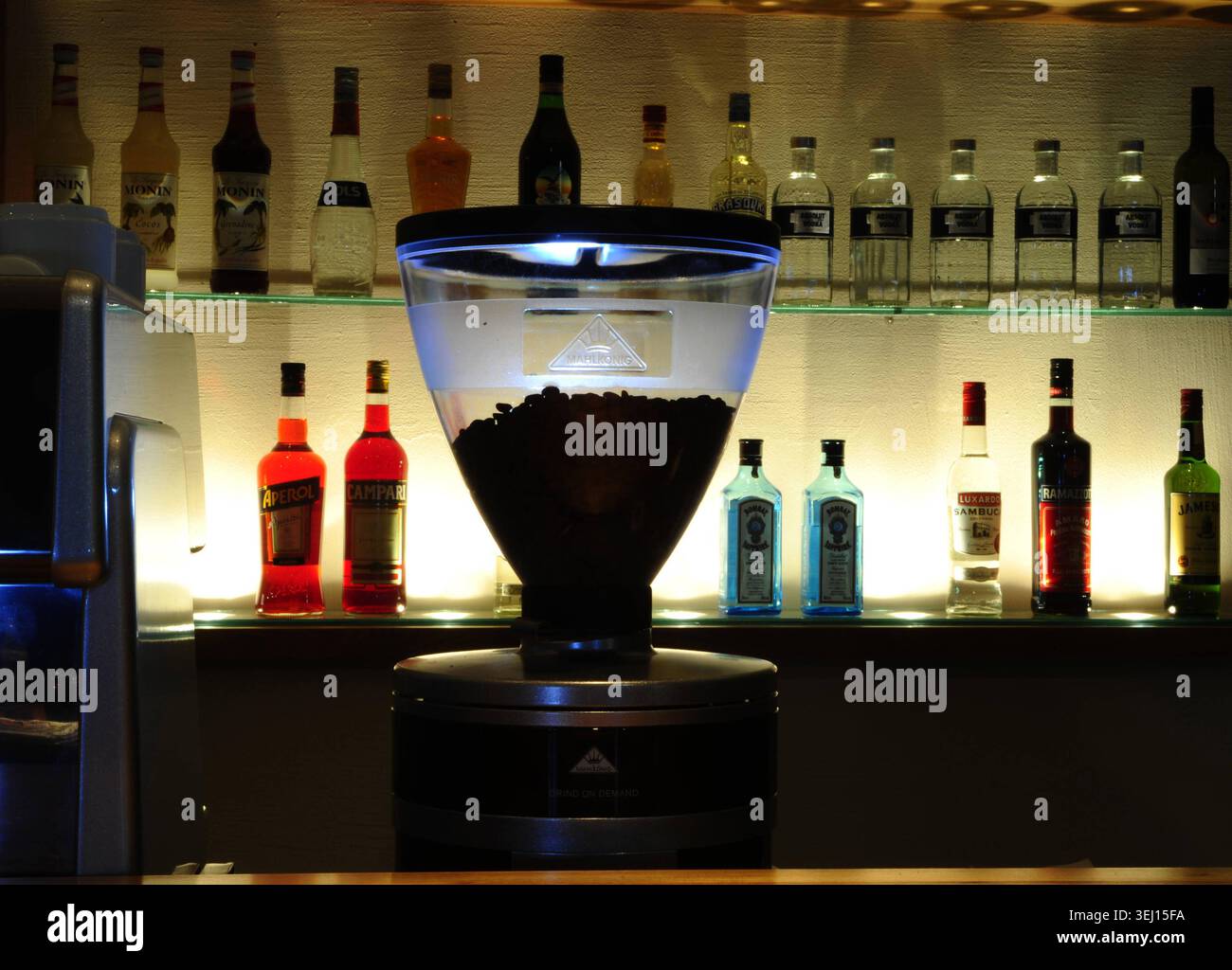 a barkeeper or bartender mixing drinks together in a bar barkeeper ...