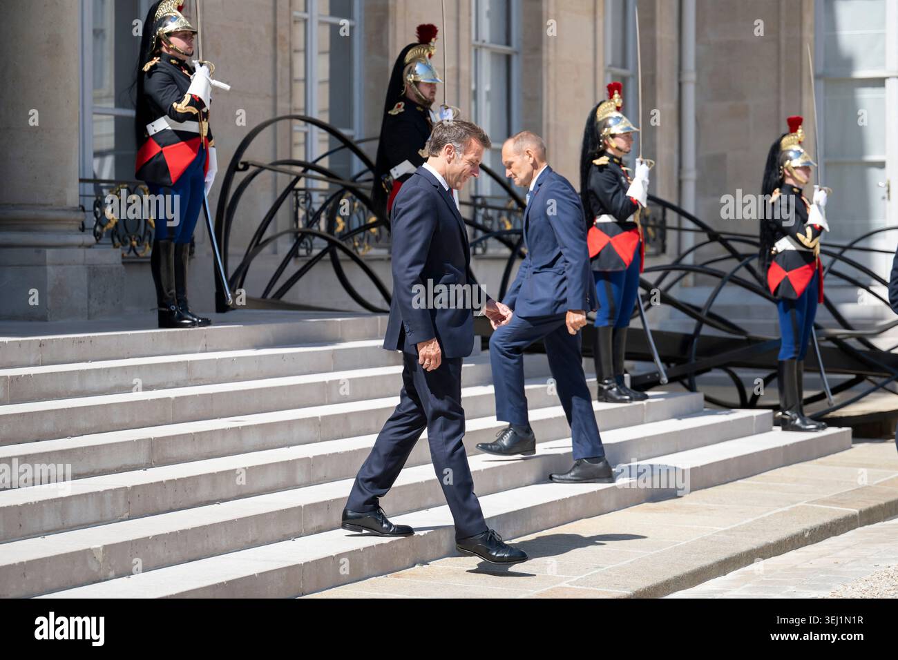 French President Emmanuel Macron looks and gestures at Elysee Palace ...