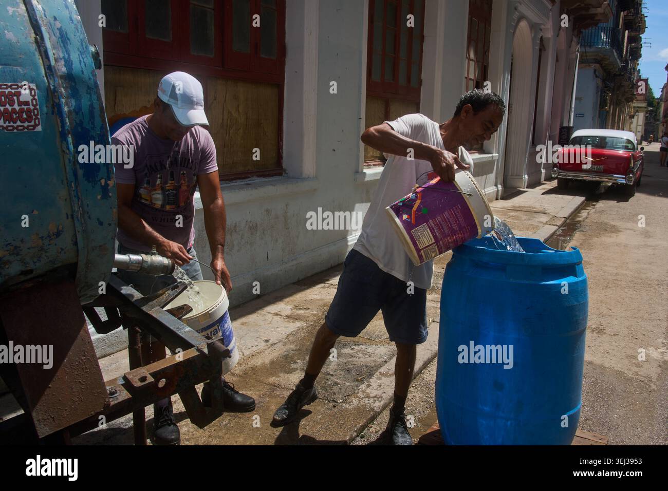 People fill containers with water in Havana, Wednesday, May 27, 2026 ...