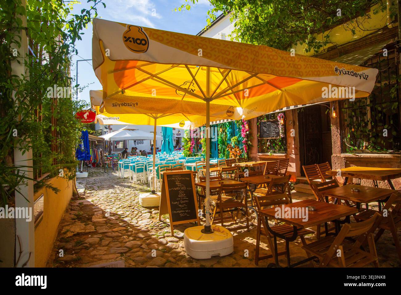 Ayvalik - Turkey, May 17, 2026, Stone houses and taverns in the back ...
