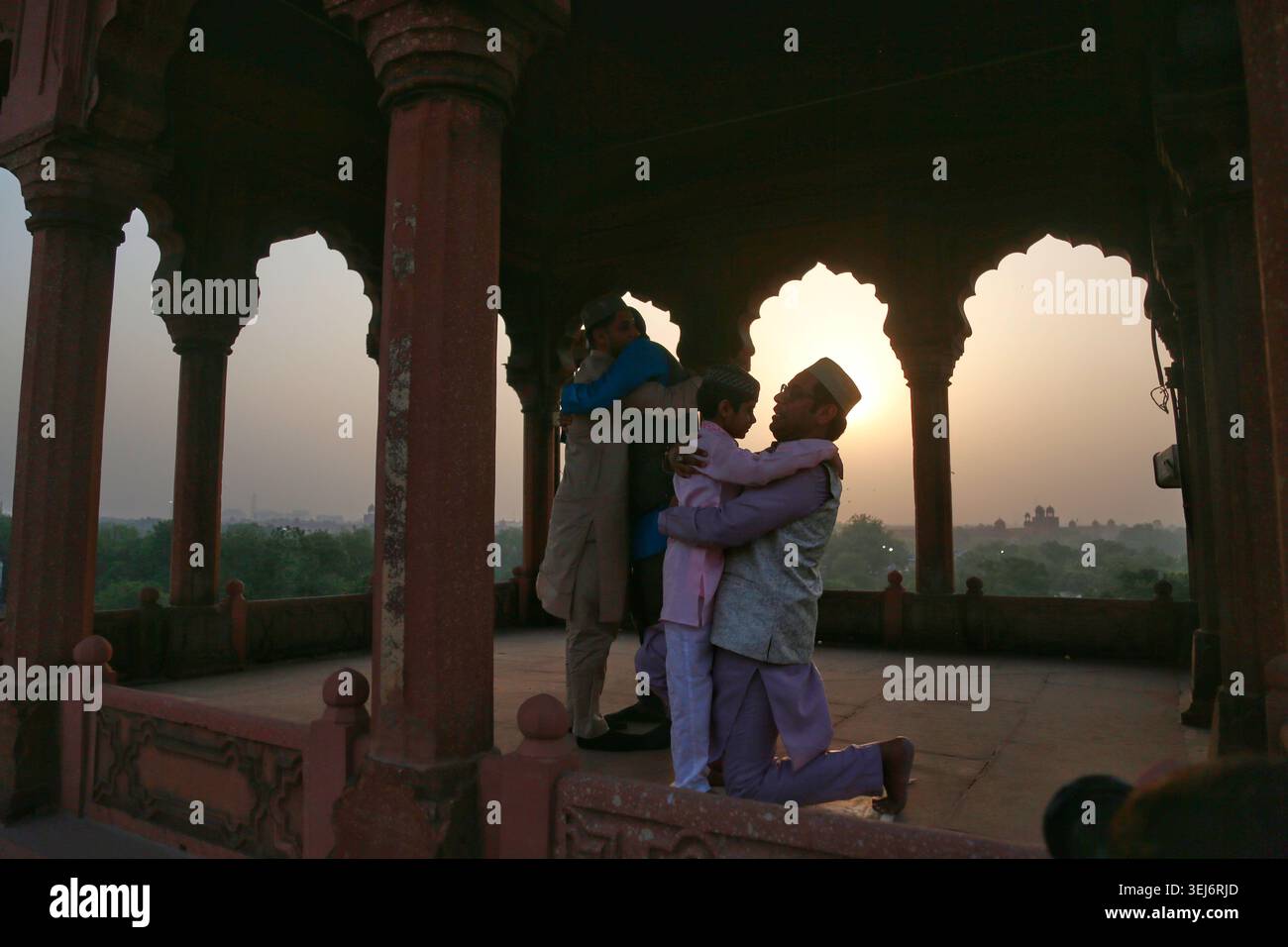 Devout Muslims greet and hug after offering Eid al-Adha prayers at the ...
