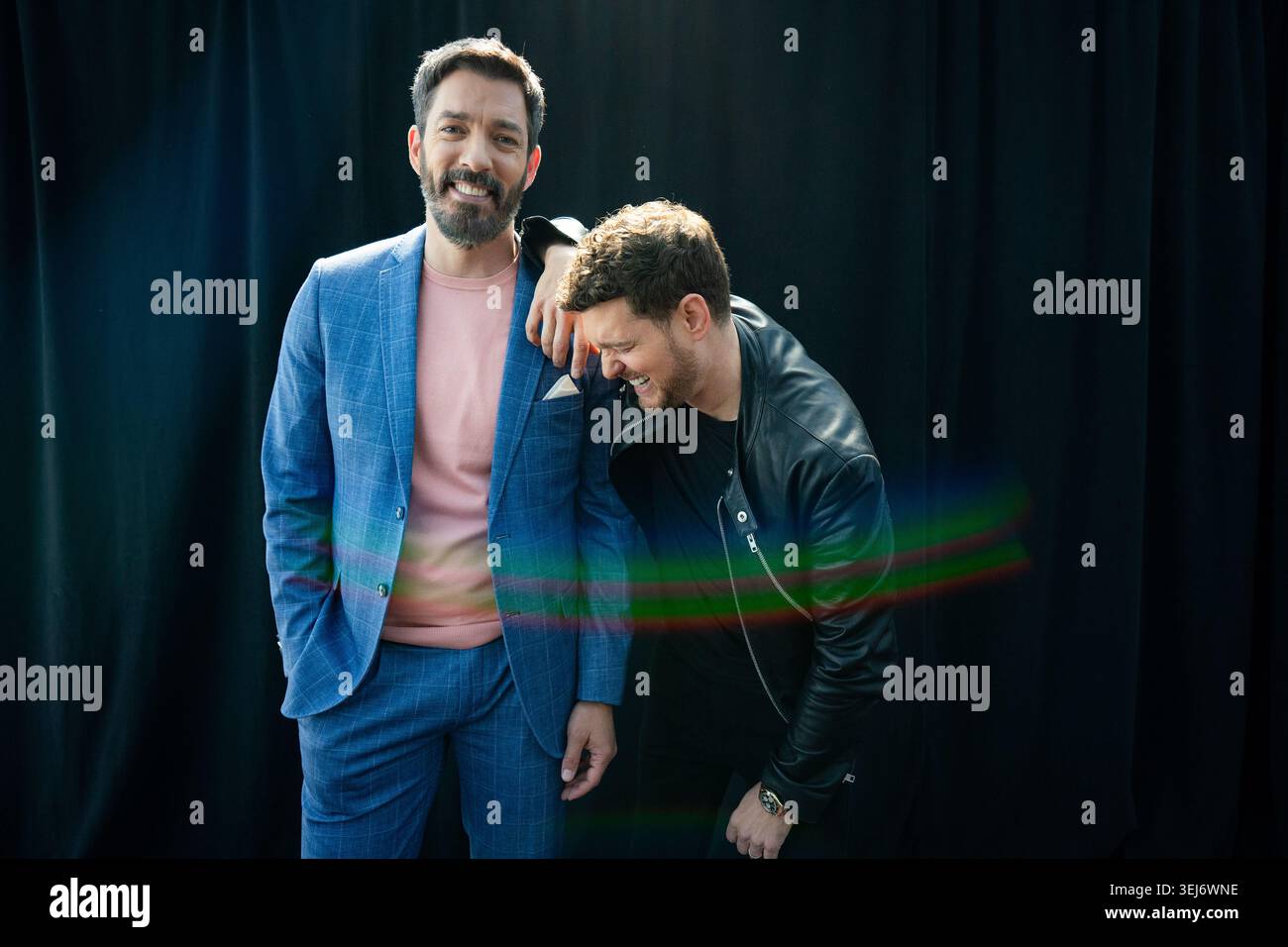 Drew Scott and Michael BublvÉ¬© pose for a photograph as they walk the ...