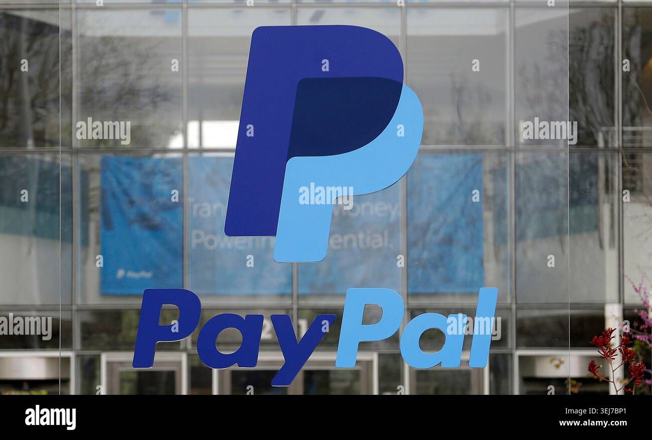 FILE - The PayPal logo hangs displayed outside their company ...