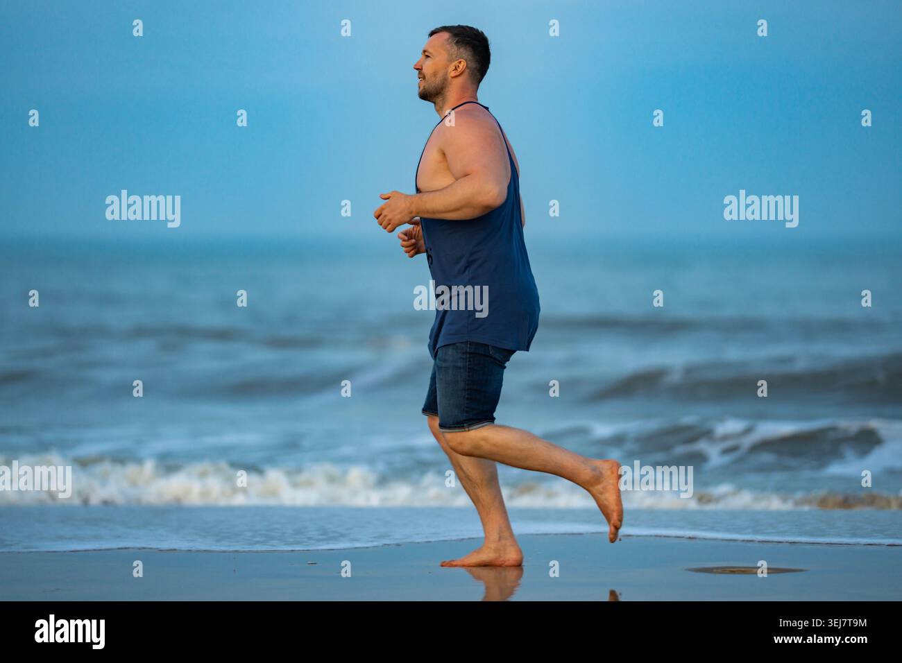 Run on sea. summer workout. Running on beach healthy lifestyle. Man ...